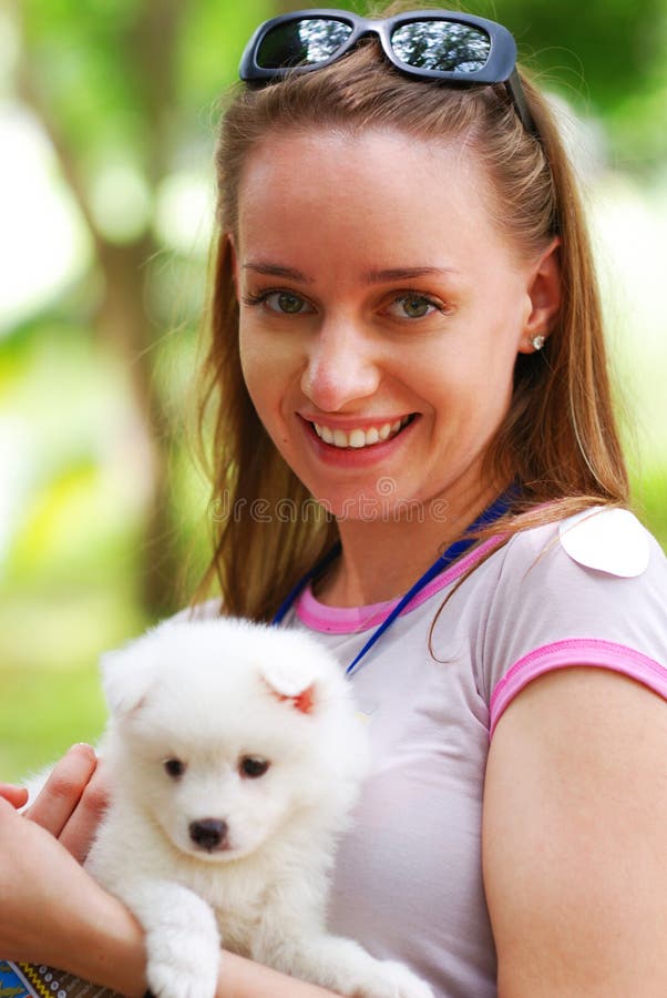 Girl with puppy stock photo. Image of blond, happy, play - 5976724