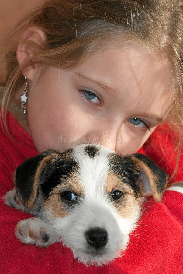 Girl with puppy dog stock image. Image of holding, closeup - 14130819