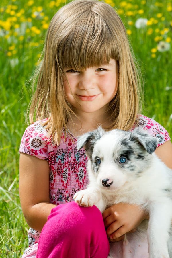 Girl with puppy stock image. Image of collie, small, spring - 41030831