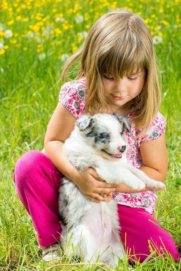 Girl with puppy stock image. Image of nature, baby, meadow - 41030903
