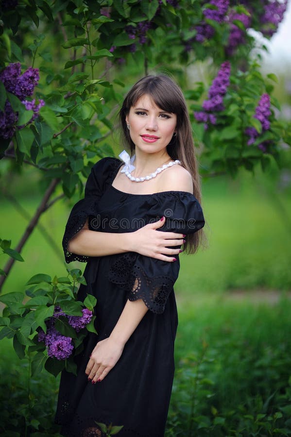 Girl with Purple Lilacs in the Spring in the Park Stock Image - Image ...