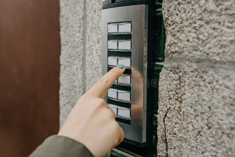 The Girl Pushes the Doorphone Button or Calls the Intercom Stock Photo ... The Girl Pushes the Doorphone Button or Calls the Intercom Stock Photo ...