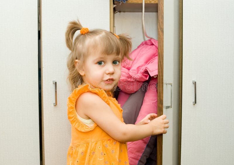 The girl puts on stock photo. Image of home, girl, opened - 13207984