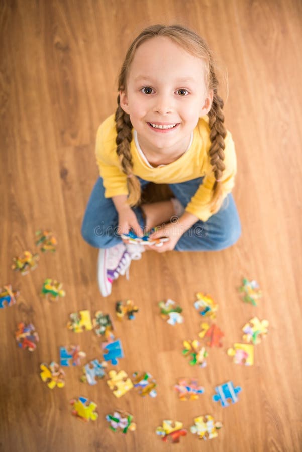 Girl with puzzle stock image. Image of happy, adorable - 53533153