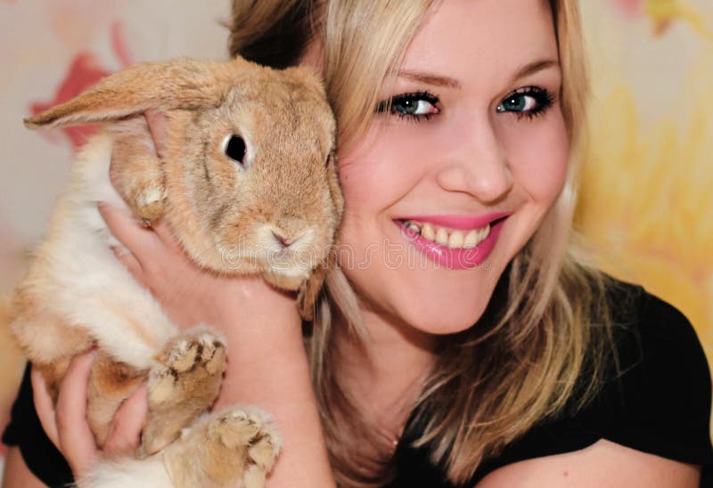 Girl and pygmy rabbit stock image. Image of ears, portrait - 53344519