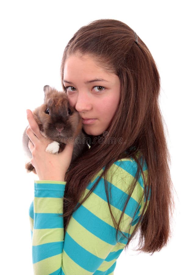 Young girl with rabbit stock photo. Image of looking - 19851672