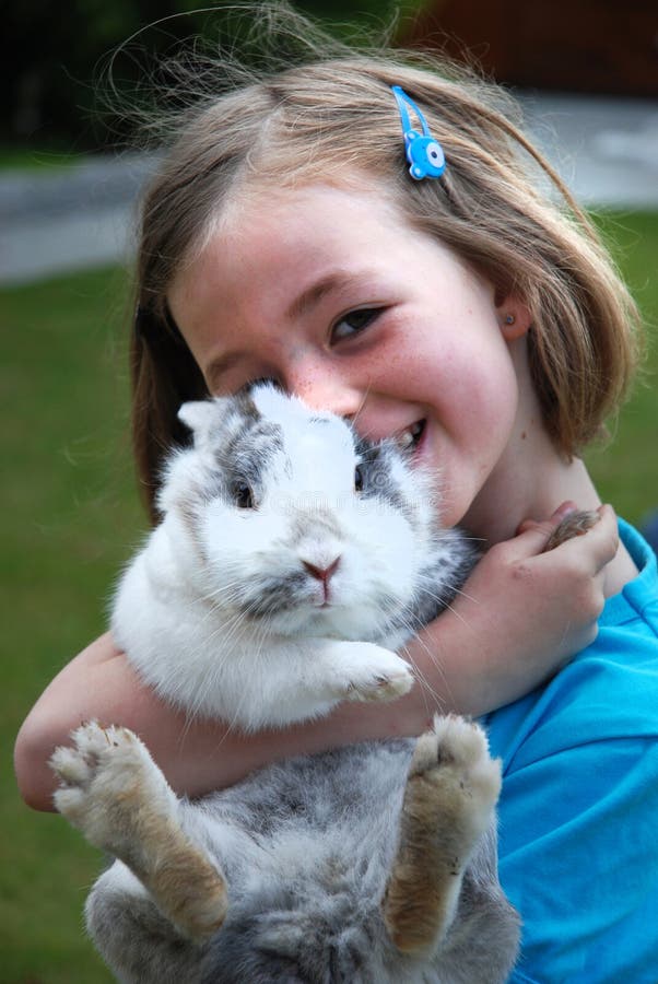 Girl with a rabbit stock image. Image of hold, girls - 20492455