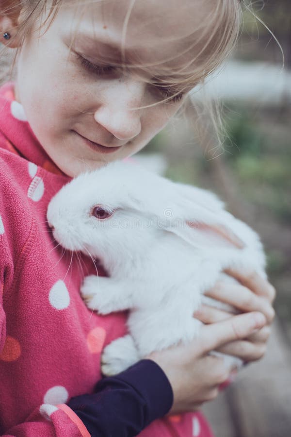 Girl and rabbit stock photo. Image of little, france - 181215928
