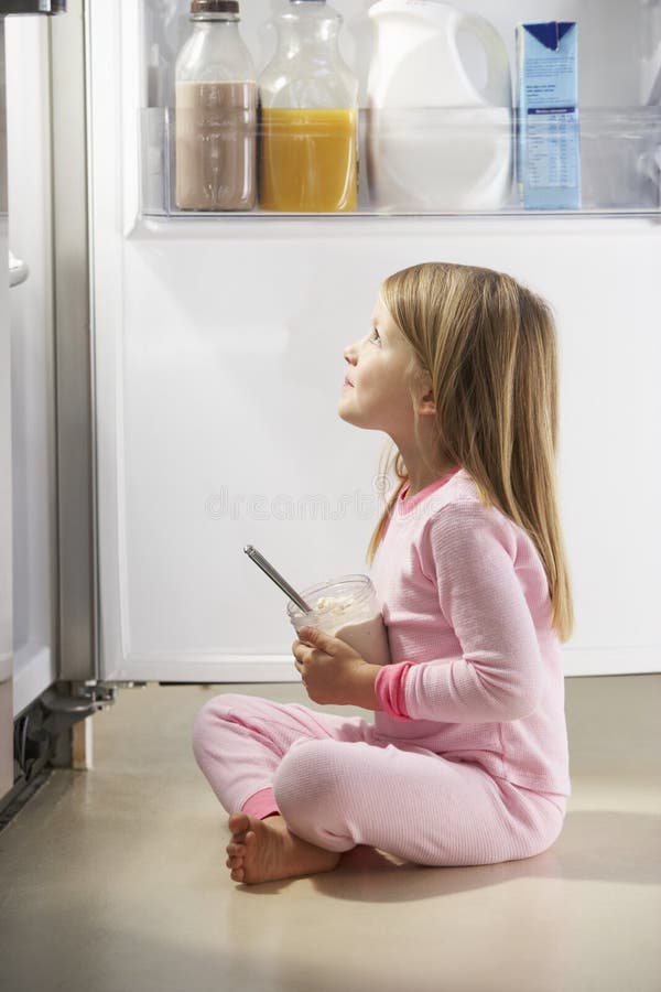 Girl Raiding the Fridge stock photo. Image of refridgerator - 55900046