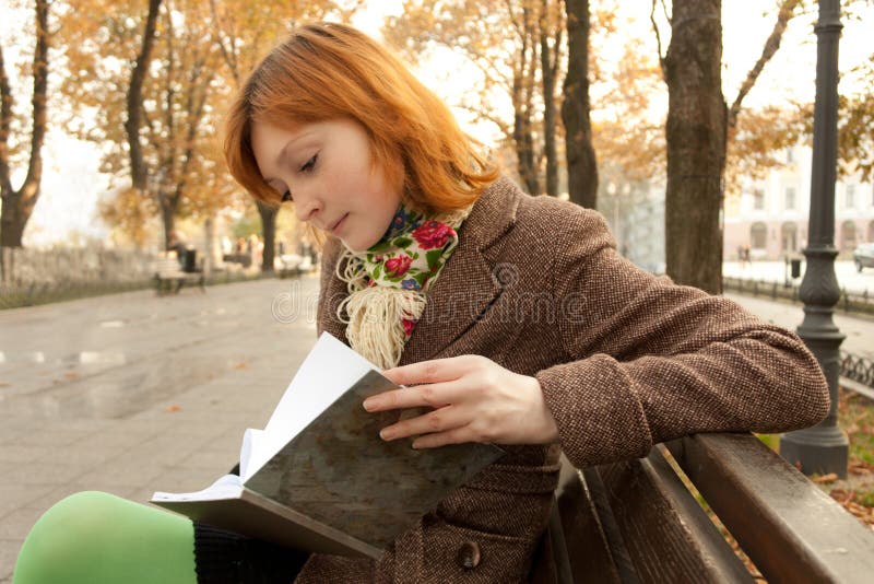 Girl Reading Book in Autumn Park Stock Photo - Image of woman, book ...