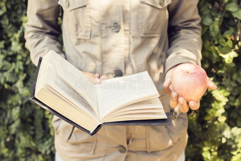 Girl Reading a Book and Carrying an Apple Stock Photo - Image of read ...