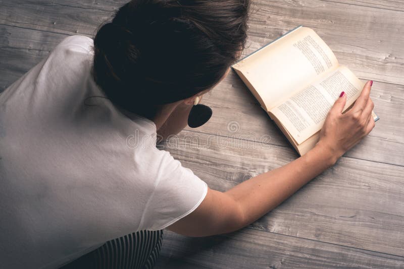 Girl Reading a Book on the Floor Stock Photo - Image of learning ...
