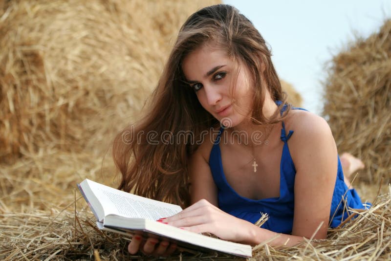 Country Girl Smiling at Haystack Stock Image - Image of brown, curly ...