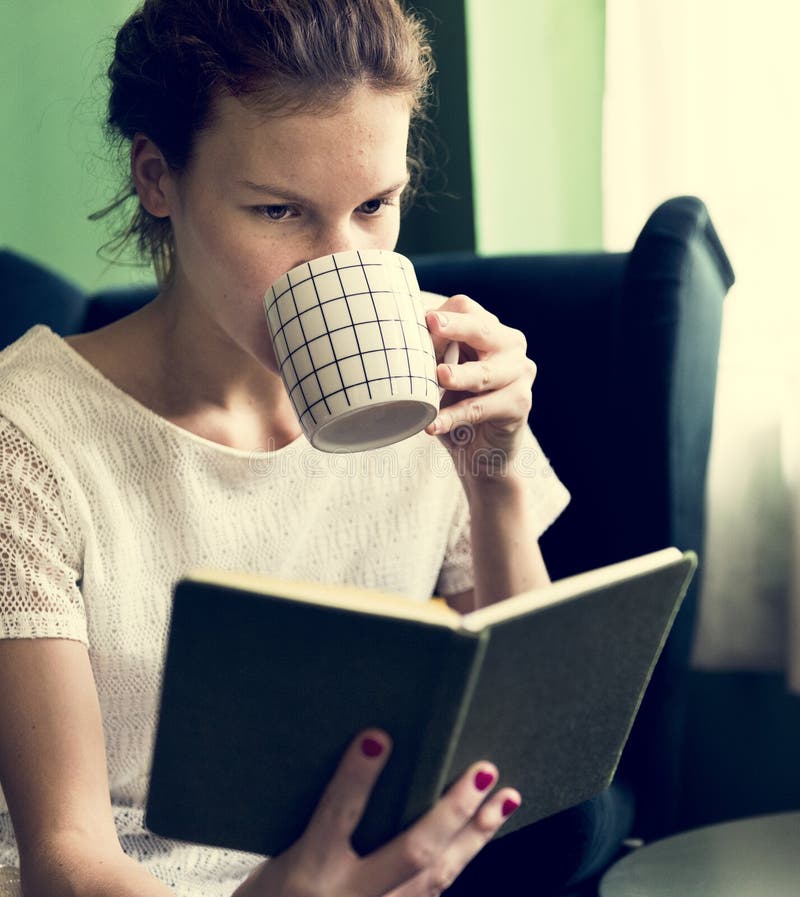 Girl Reading a Book at Home Stock Photo - Image of homework, casual ...