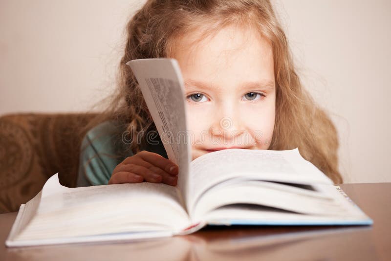 Girl reading book at home stock image. Image of reading - 94944193