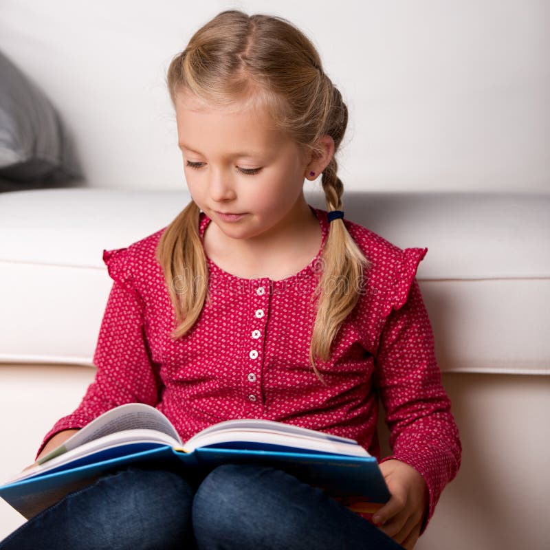 Girl Reading Book at Home stock photo. Image of childhood - 43966768