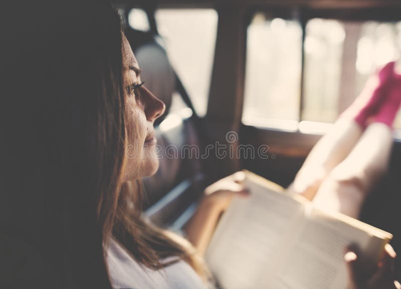 Girl Reading Book Inside Car Concept Stock Image - Image of novel ...