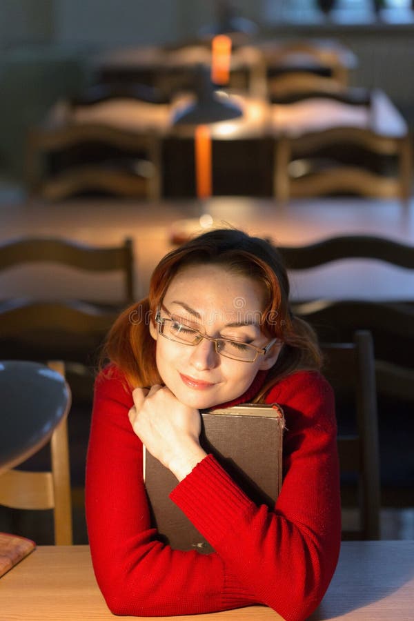 Girl Reading a Book in the Library Under the Lamp Stock Photo - Image ...