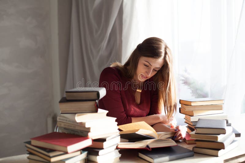 Girl Reading Book Prepares for the Exam in the Library Stock Photo ...