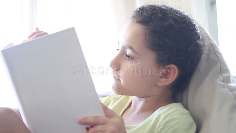 Very Cute Girl Reading a Book Side View Stock Video - Video of ...