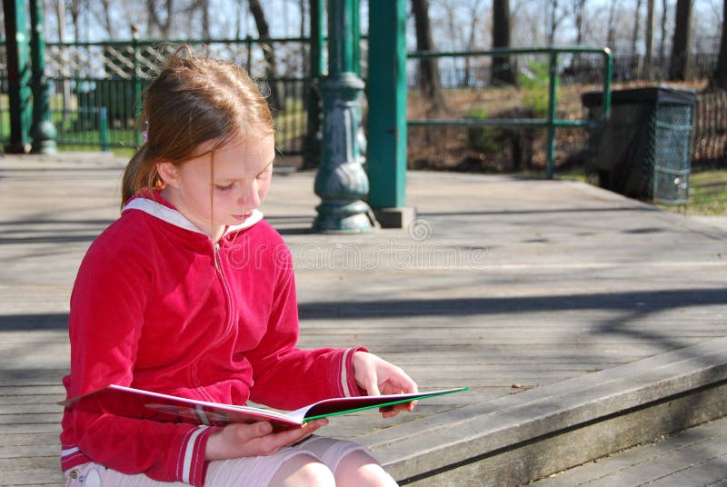 Girl reading outside stock image. Image of book, girl, girls - 729293