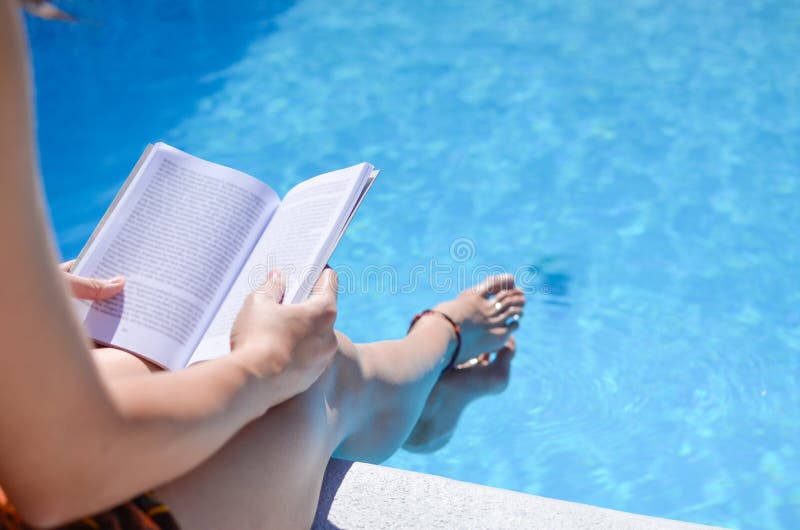 Girl Reading a Book by the Pool Stock Photo - Image of blue, relaxing ...