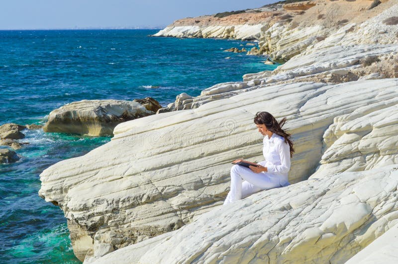 Girl reading by the sea stock image. Image of reading - 37756159