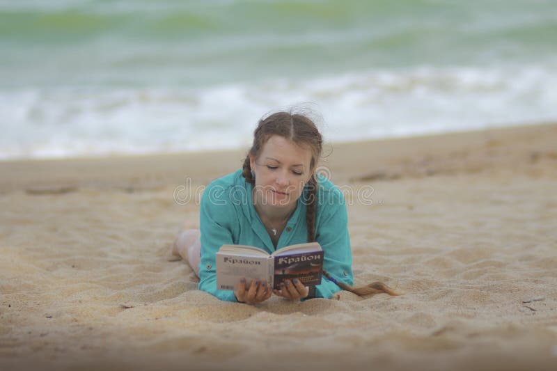 A Girl Reads a Book on a Sandy Beach Stock Image - Image of sand, play ...
