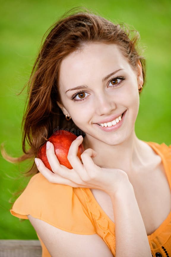 Girl with red apple stock photo. Image of green, eating - 15302374