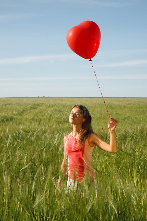 Girl with the red balloon stock image. Image of enjoyment - 58364271