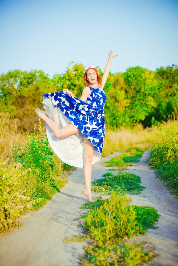 The Girl with Red Hair is Dancing Stock Image - Image of meadow, hair ...