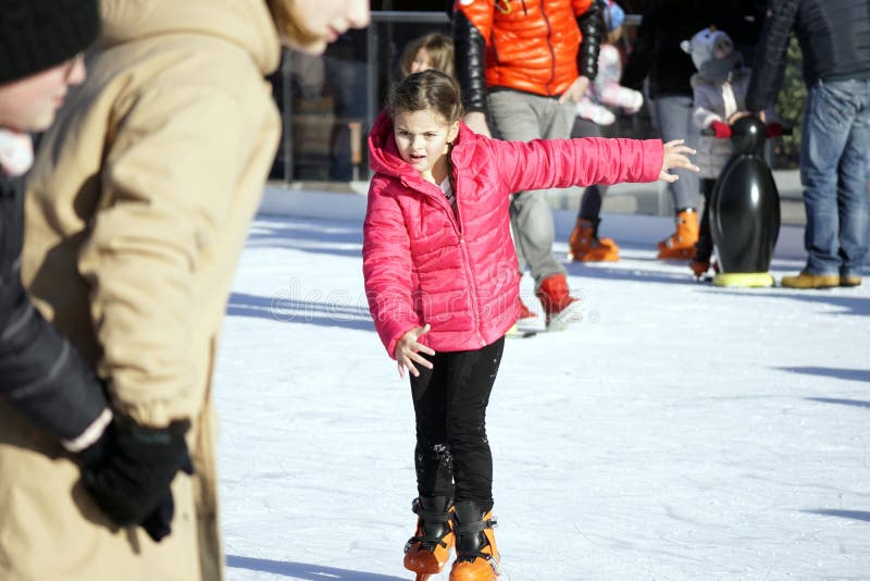 Girl in the Red Jacket Skating at the Ice Ring Editorial Photo - Image ...