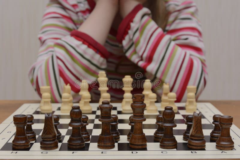 The Girl Reflects on the First Chess Move Stock Photo - Image of ...