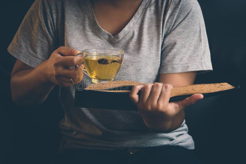 A Girl Relaxing Read Book and Drink Hot Tea Stock Image - Image of ...