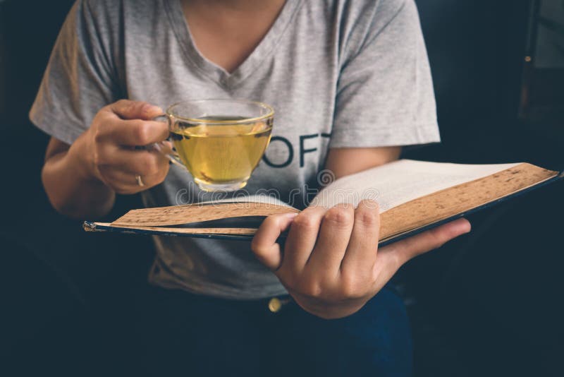 A Girl Relaxing Read Book and Drink Hot Tea Stock Photo - Image of ...