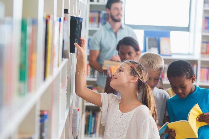 Girl Removing Book from Bookshelf in Library Stock Image - Image of ...