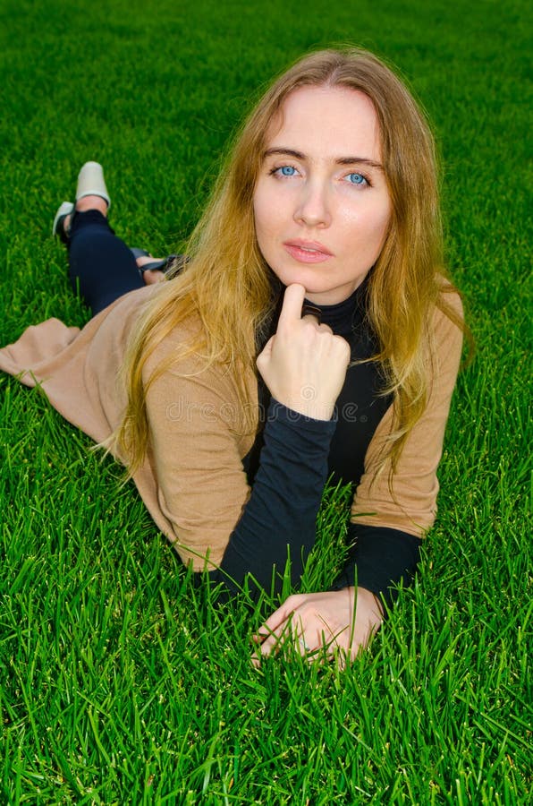 Girl Resting on the Green Lawn Stock Image - Image of closeup, break ...