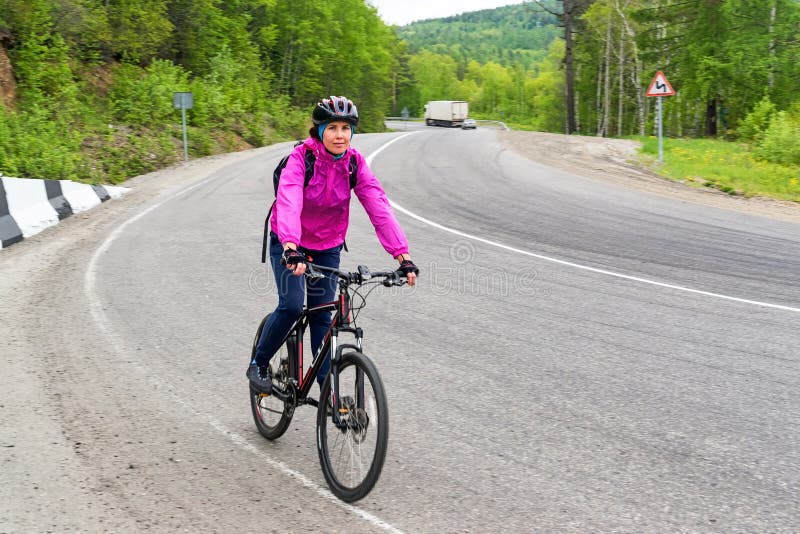 The Girl Rides Bicycle on Highway Stock Photo - Image of travel ...