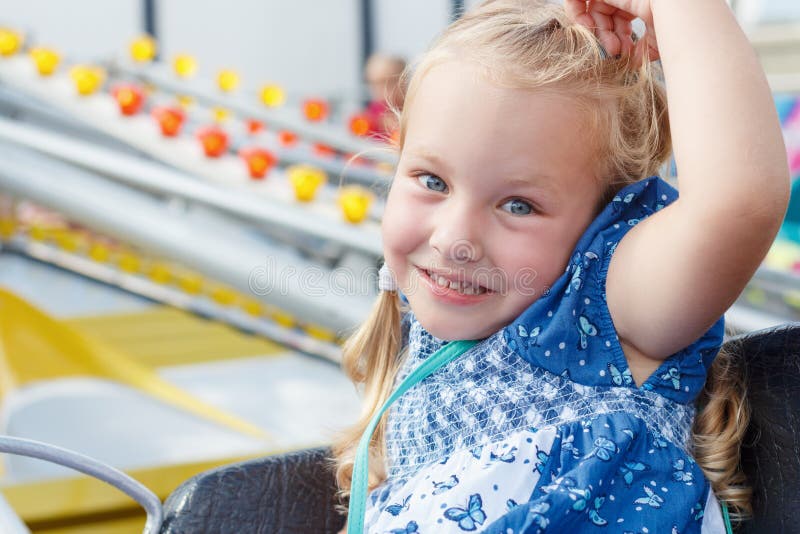 A girl rides carousel stock photo. Image of festival - 68783430