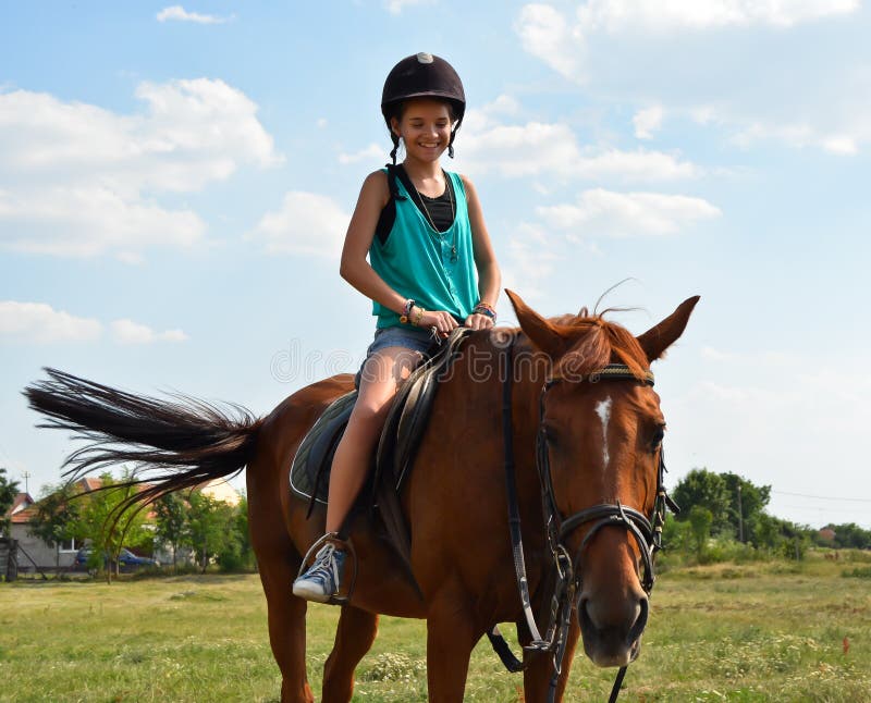 Girl rides on a horse stock image. Image of field, grass - 25506013
