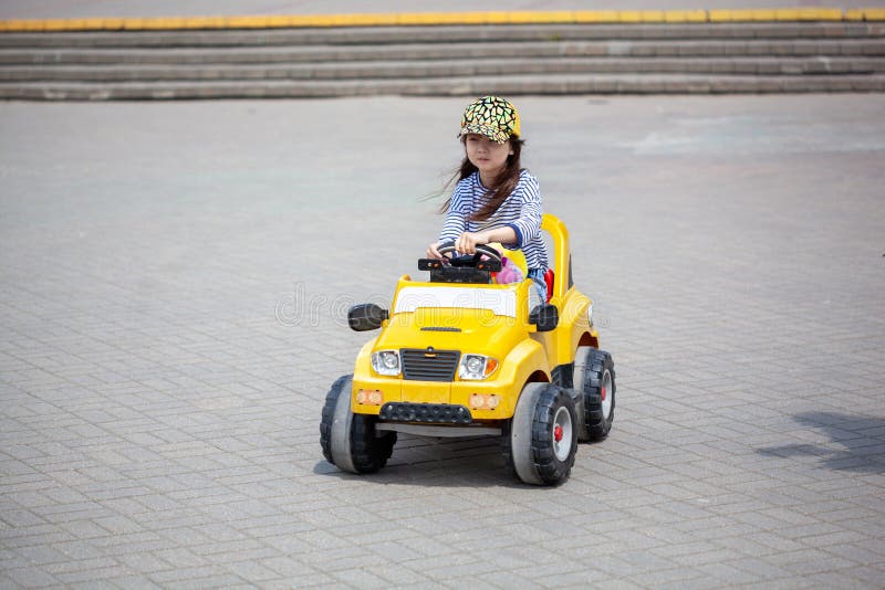Girl Rides On Toy Electric Car In The Park In Summer Day Stock Image Image Of People Machine