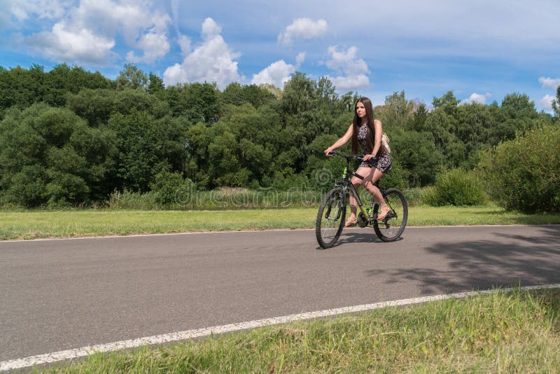 Girl Riding a Bicycle. Side View Stock Photo - Image of boho, bike ...