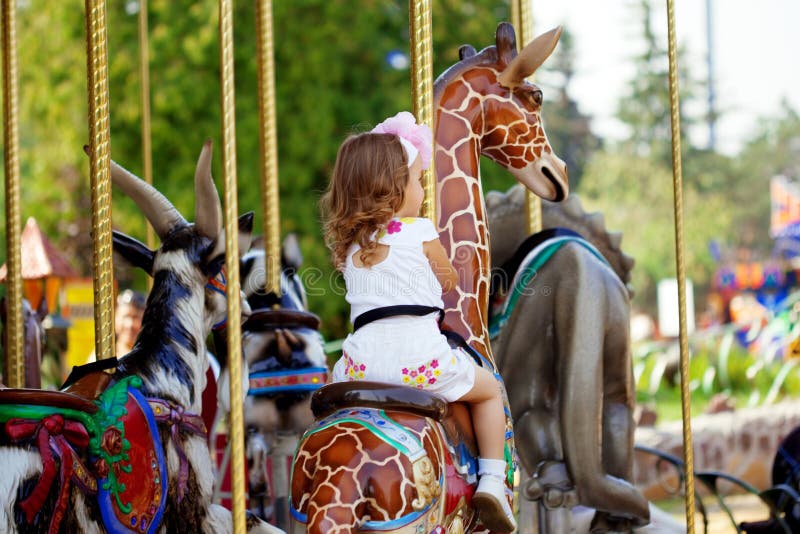 Girl riding on a carousel stock image. Image of circle - 18608997