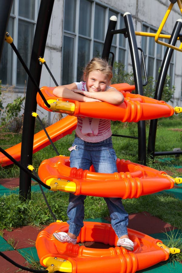 Girl Riding Rides on a Child Playground Stock Image - Image of ...