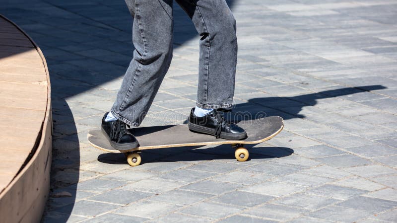 A Girl Riding a Skateboard on Paving Slabs Stock Photo - Image of ...