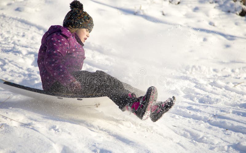 Girl Riding on Snow Slides in Winter Time Stock Photo - Image of child ...