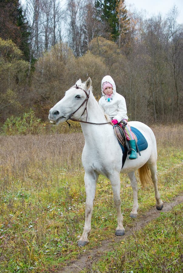 Girl Riding on a White Horse Stock Image - Image of nature, cute: 78976721