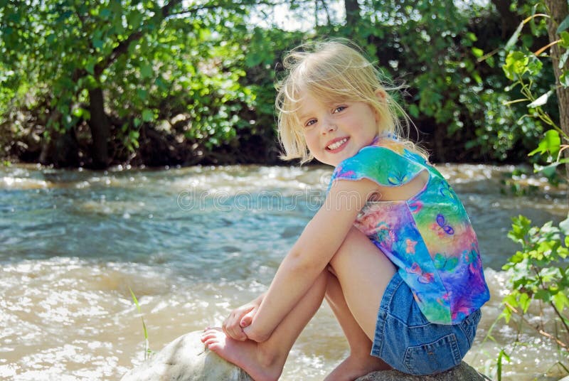 Girl on river rock stock photo. Image of nature, happiness - 19641338