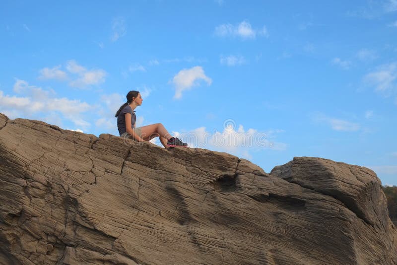 Girl on Rock stock image. Image of freedom, confident - 37477147