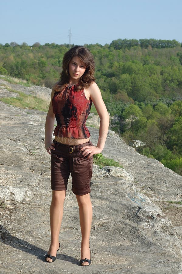 Girl on the rock stock photo. Image of extreme, attractive - 5735888